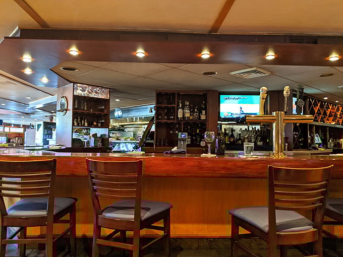 A bar that promises stories with every sip &ndash; where polished wood meets brass fixtures and every stool offers a front-row seat to mixology magic.