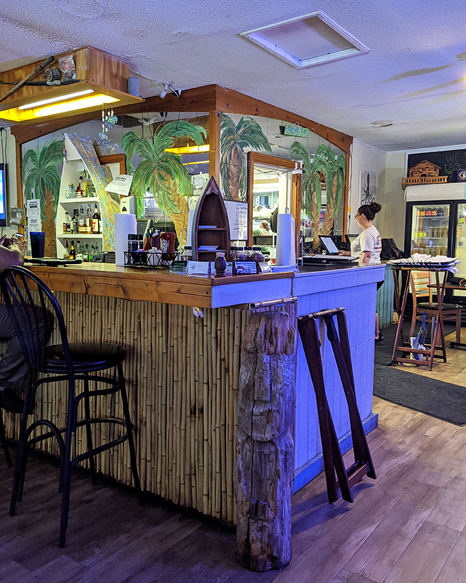 The tiki-inspired bar with palm tree murals brings the outside in. Even the decor tells you seafood is the star here.