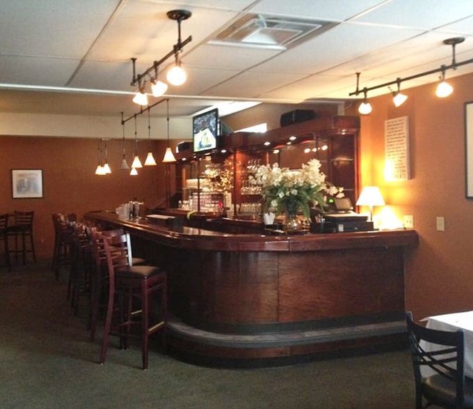 The curved wooden bar invites conversation between strangers who'll leave as friends. Some of life's best stories begin with "I was at this amazing little place in Erie&hellip;"