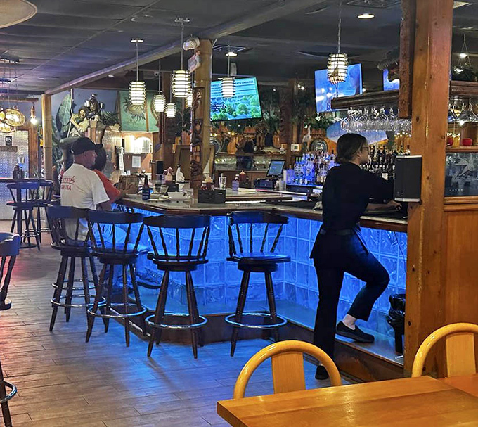 The blue-lit bar &ndash; where locals tell fishing stories that grow taller with each cocktail. Truth is optional, good times mandatory.