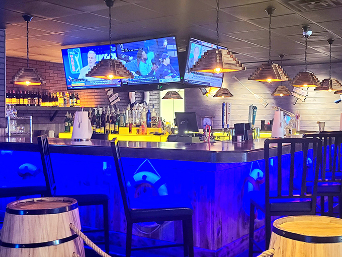 Pyramid-shaped pendant lights illuminate the bar where sports on TV and seafood-friendly cocktails create the perfect storm of contentment.