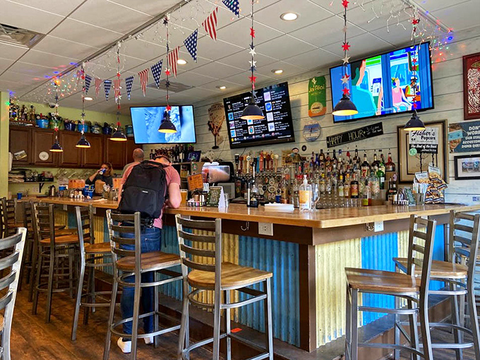 The corrugated metal bar front adds rustic charm to this gathering spot where locals and tourists alike find common ground over great drinks.