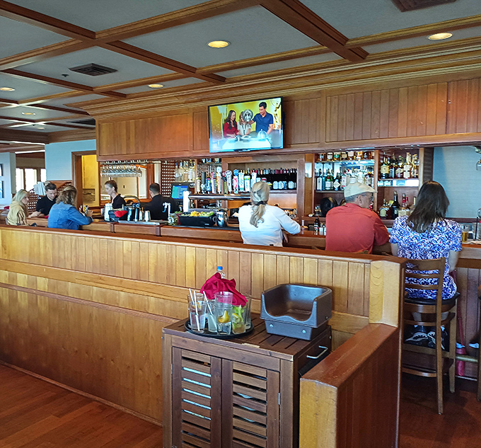 The upstairs bar area offers refuge for those waiting for tables or simply enjoying a pre-dinner drink while plotting their seafood strategy.