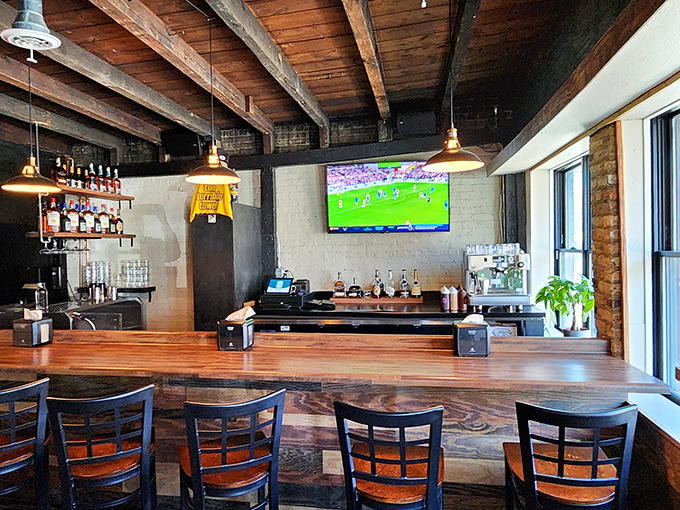 The bar area balances warmth and industrial edge &ndash; where craft beers flow and sports play while you contemplate your next barbecue adventure.