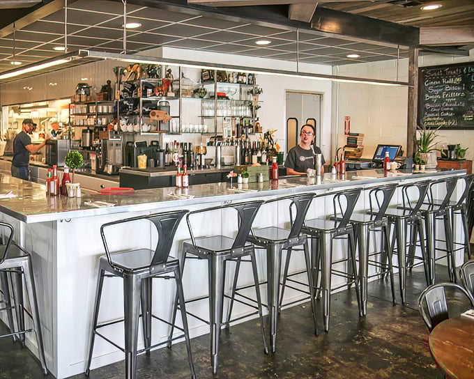 The bar counter offers front-row seats to the breakfast ballet. Gleaming surfaces, organized chaos, and the promise of coffee refills make these the best seats in the house.