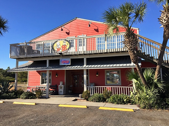 The Beach Pit's coral-colored charm and elevated deck create the perfect perch for sunset-watching after a day of island exploration.