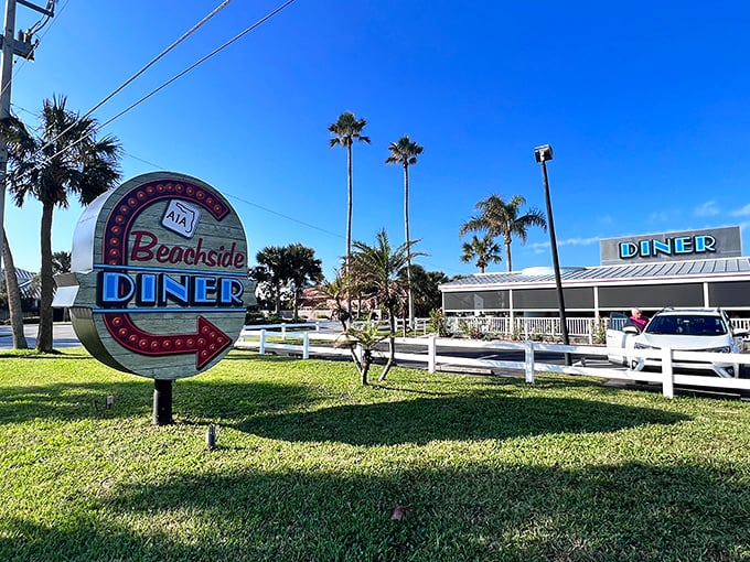 Beachside Diner's neon sign promises the kind of breakfast that makes you forgive the early wake-up call. Morning people were right all along.