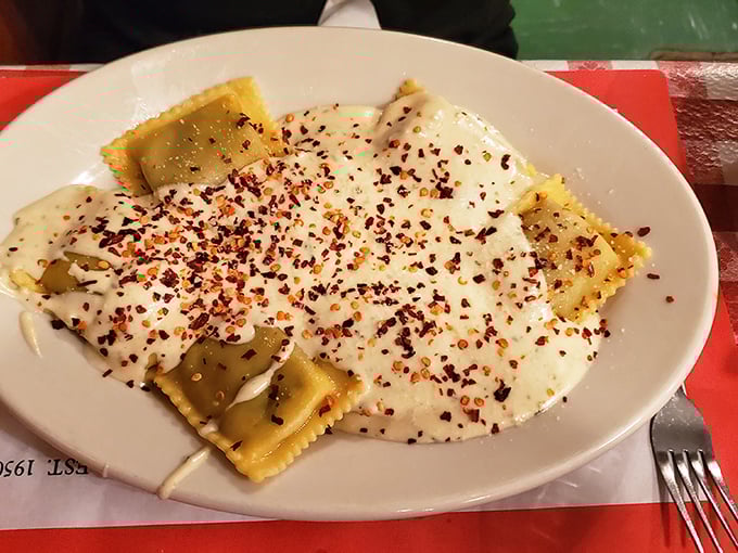 These ravioli pillows blanketed in creamy sauce and red pepper flakes are what comfort food dreams are made of.