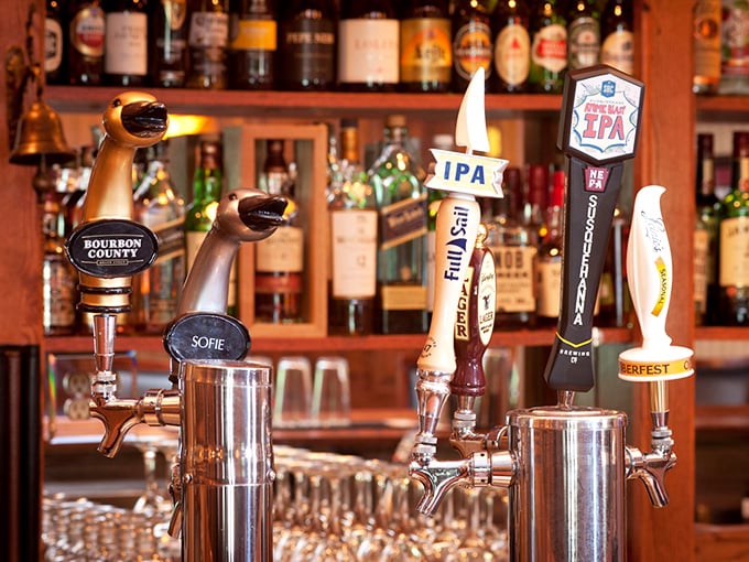 Craft beer taps stand at attention, ready to pour liquid happiness for thirsty patrons seeking the perfect brew.