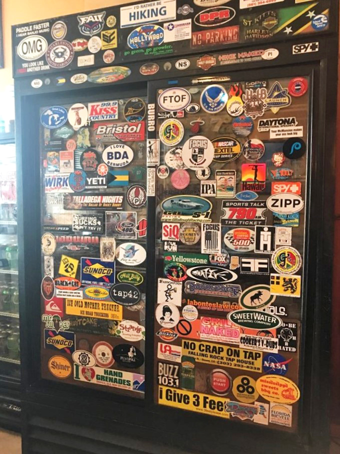 A door plastered with stickers tells stories of travelers who've made the pilgrimage—each decal a badge of BBQ honor.
