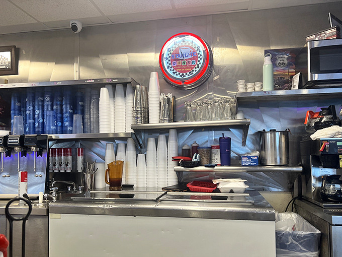 Behind the scenes, the organized chaos of cups, glasses, and coffee equipment stands ready for the next rush of thirsty diners seeking their caffeine fix.