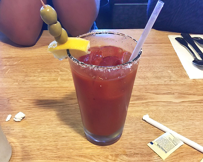 Their Bloody Mary comes properly garnished with olives and a lemon wedge. The salt rim isn't just decoration&mdash;it's a flavor essential.
