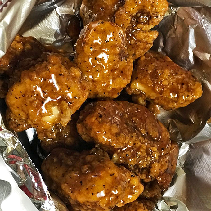 Glistening boneless wings that look like they've been dipped in liquid gold. These saucy morsels promise a sweet-heat flavor explosion.
