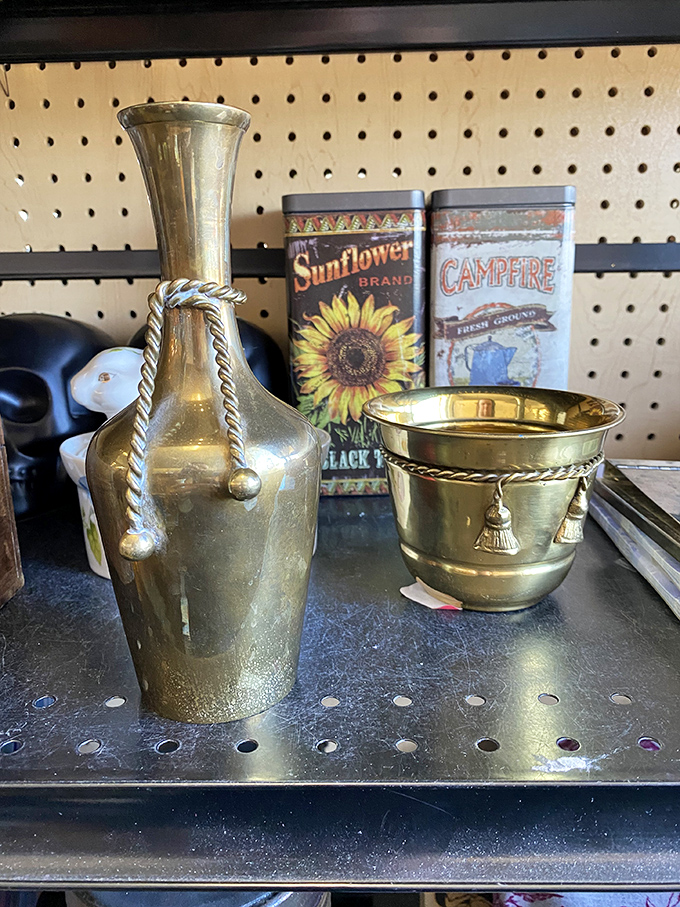 Brass treasures gleaming under fluorescent lights, flanked by vintage-inspired tins—perfect for the home bar that's aiming for that "I inherited this from a sophisticated relative" vibe.