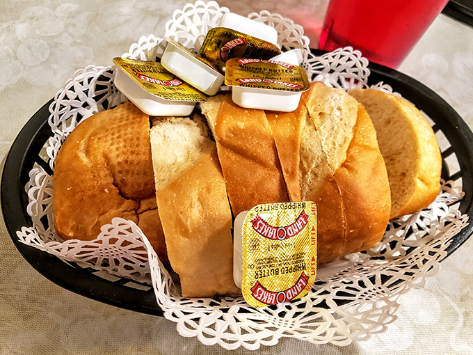 The bread basket—civilization's greatest achievement. These fresh-baked rolls are just waiting to become sauce-sopping implements of culinary delight.