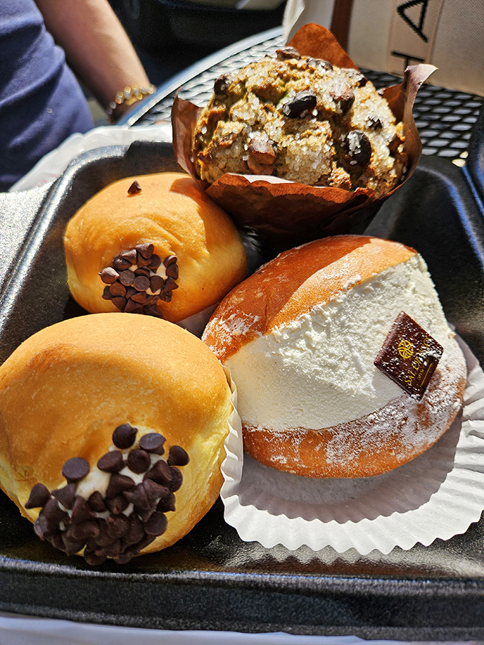 A dessert tray that doesn't just tempt&mdash;it practically pulls your wallet out for you. The chocolate-dotted donuts alone are worth the drive.