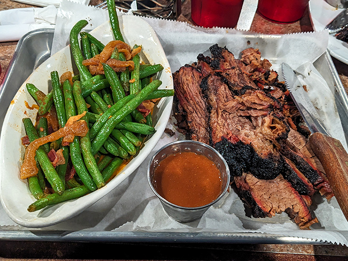 Brisket so tender it practically poses for the camera, while those green beans aren't just a side—they're vegetables that have found their higher purpose.