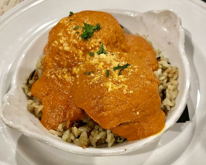 These aren't just meatballs&mdash;they're orange-hued flavor bombs nestled on a bed of wild rice, waiting to ambush your taste buds.