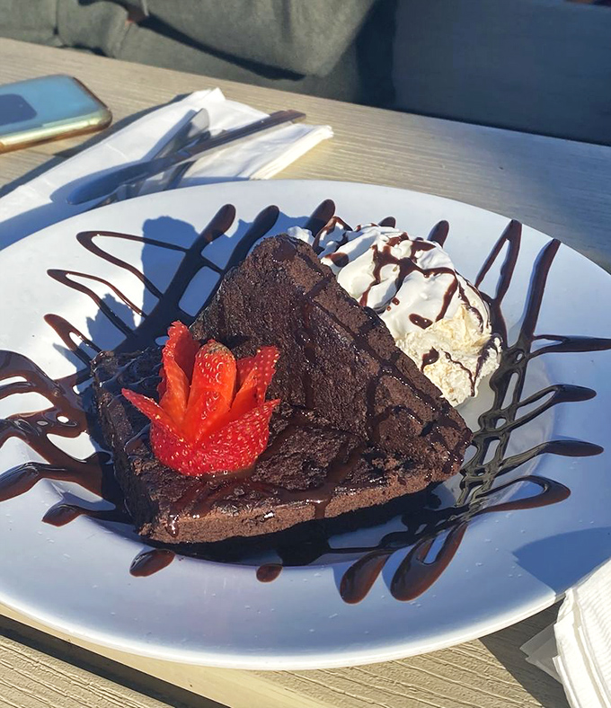 A chocolate brownie that's playing dress-up with strawberry and ice cream&mdash;the dessert equivalent of a beach vacation in formal wear.