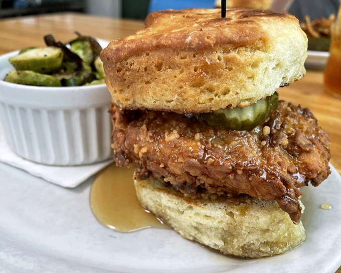 The Bumblebee biscuit sandwich with honey drizzle&mdash;where sweet meets savory in a relationship that makes Romeo and Juliet look casual.
