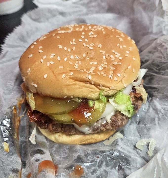 This isn't just a burger&mdash;it's a hand-formed masterpiece where pickles, lettuce and beef achieve the harmony that world leaders can only dream about.