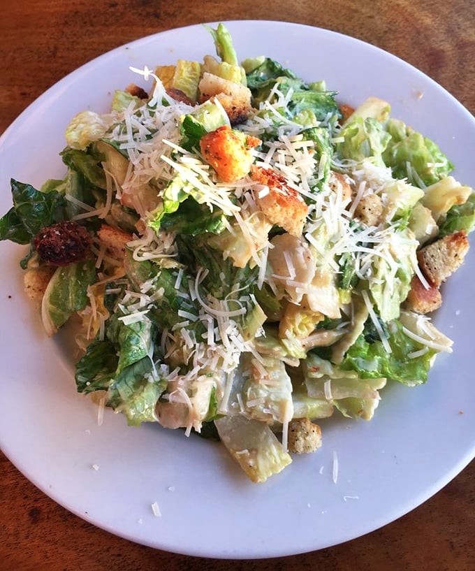Even the Caesar salad gets the coastal treatment. Those croutons have better real estate than most California homes.