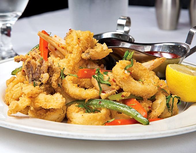 Calamari that's taken a spa day in seasoned flour before its hot oil plunge. Crispy, tender, and ready for its close-up.