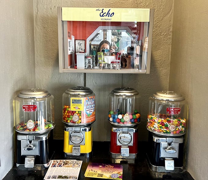 Old-school candy machines standing guard like sweet sentinels of childhood. One quarter for a handful of nostalgia&mdash;inflation hasn't touched everything.