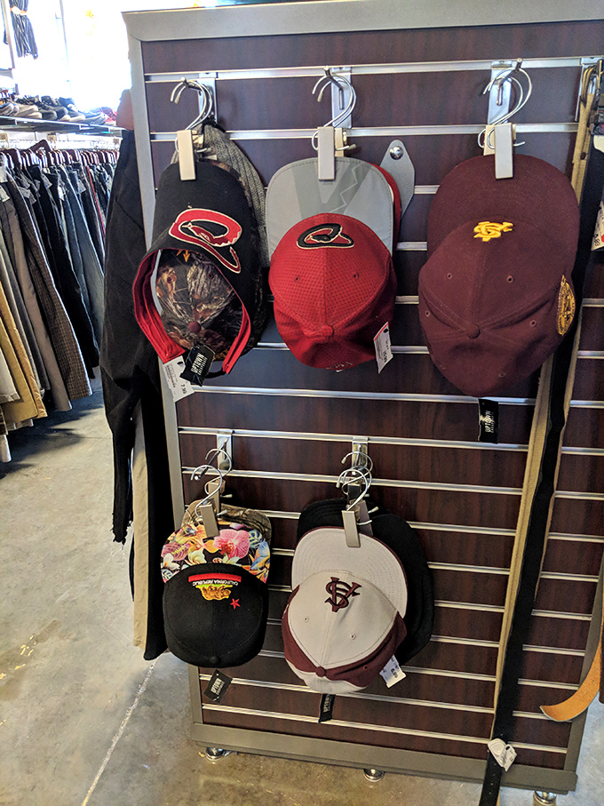Hat headquarters! Where Arizona sports loyalties hang side by side in peaceful coexistence, waiting to shield you from that desert sun.