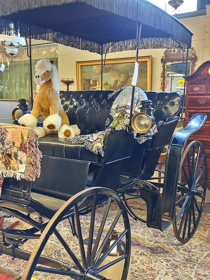 A vintage carriage that puts modern luxury vehicles to shame. That teddy bear isn't just along for the ride&mdash;he's been waiting a century for someone to take him home.