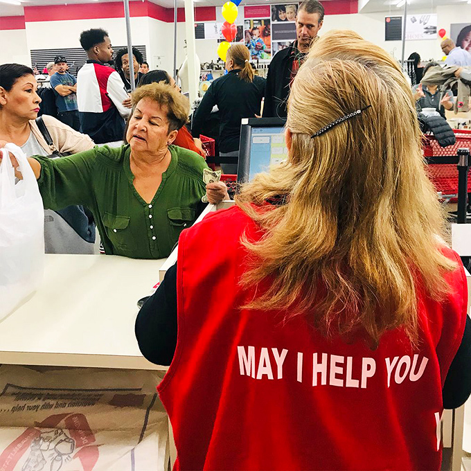 "May I help you" isn't just on the vest&mdash;it's the philosophy that makes this place special. Every purchase supports community programs.
