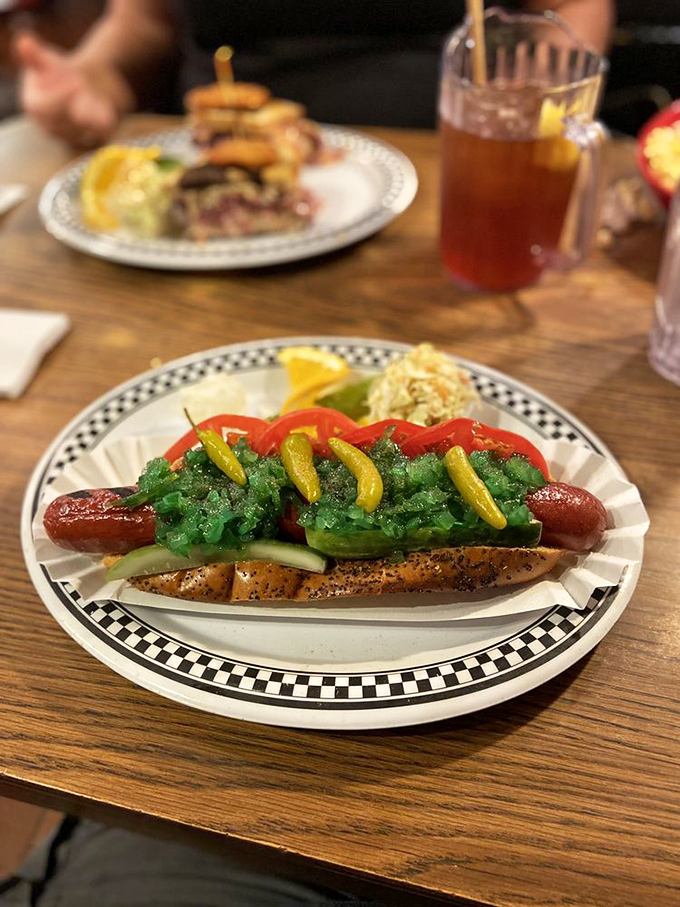 This Chicago-style hot dog has more toppings than some people have kitchen utensils. A garden of pickles and peppers on a bun.