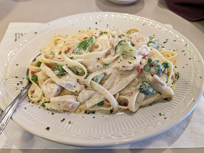 Fettuccine Alfredo with chicken and vegetables &ndash; a creamy canvas of comfort that proves sometimes the simplest combinations create the most satisfying meals.
