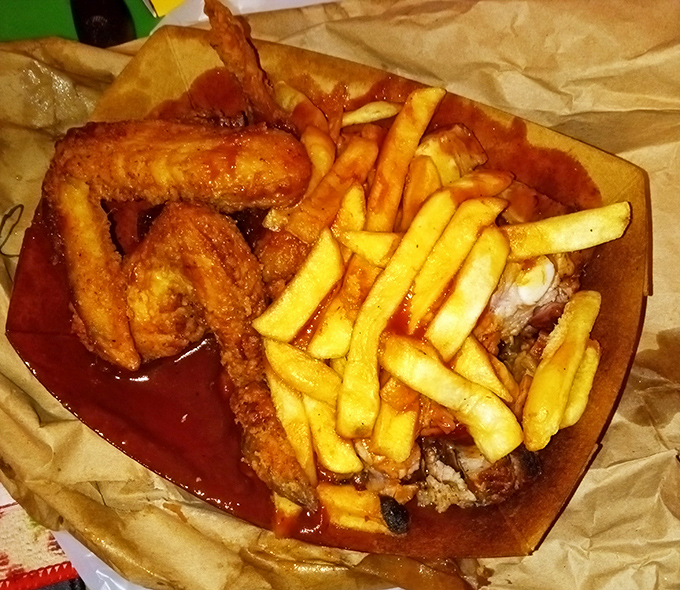 Ribs displaying that telltale pink smoke ring—the barbecue equivalent of a designer label, announcing its pedigree with every bite.
