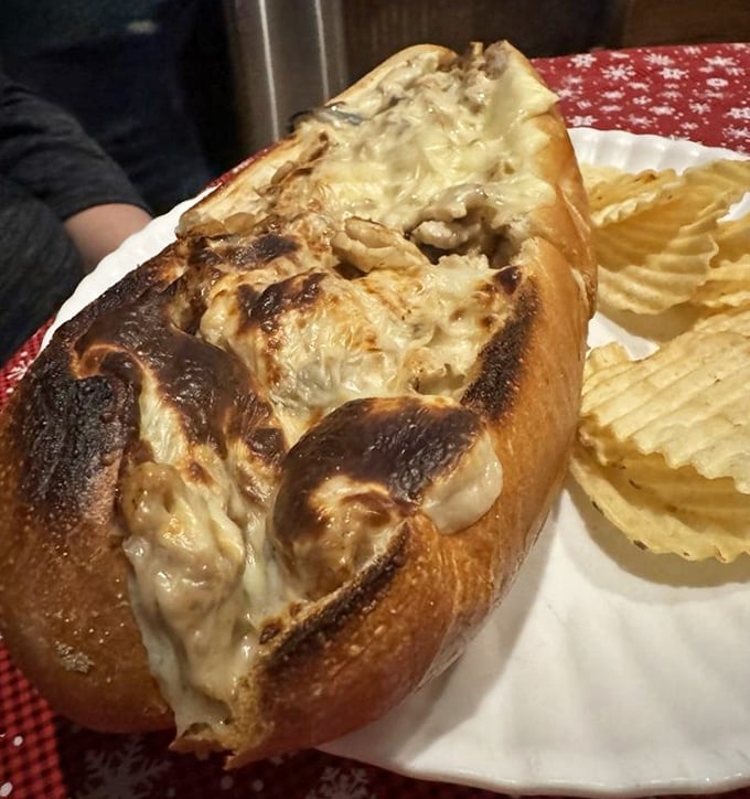 This sandwich isn't melting&mdash;it's surrendering to its own deliciousness, with cheese cascading over the sides in glorious abandon.