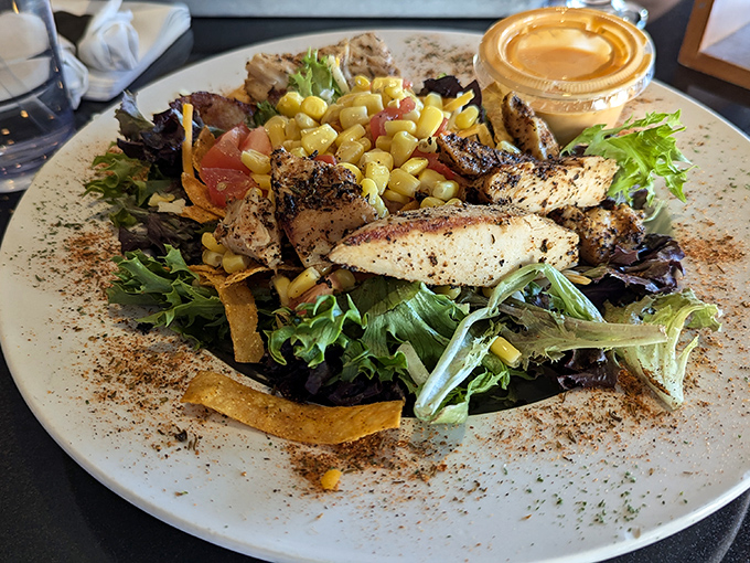 A salad that's trying to be a fiesta. Those grilled chicken strips are the party hosts, making sure everyone has a good time.