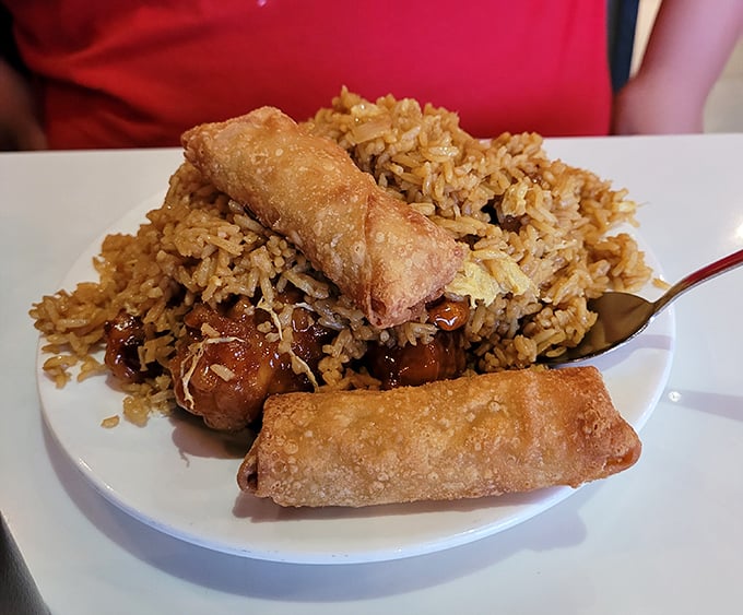 Fried spring rolls perched atop seasoned rice&mdash;proof that sometimes the simplest combinations deliver the most satisfying flavors.