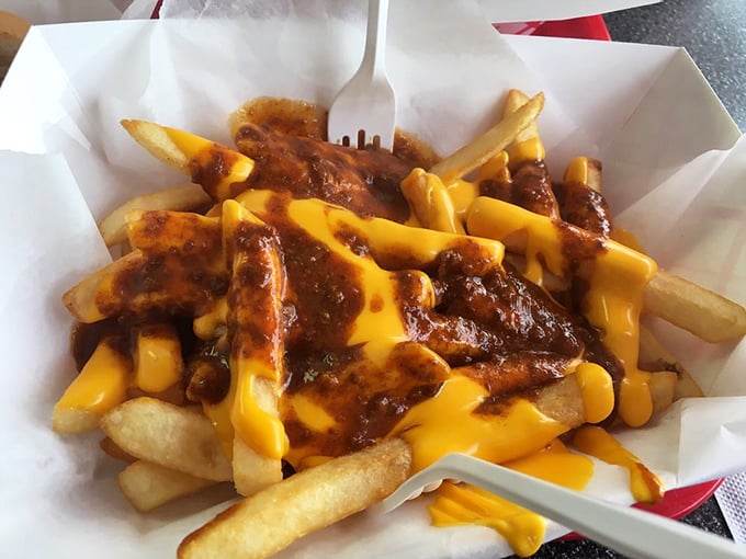 Chili cheese fries that require both a fork and a moment of silent appreciation &ndash; a glorious mess that's worth every napkin you'll need afterward.