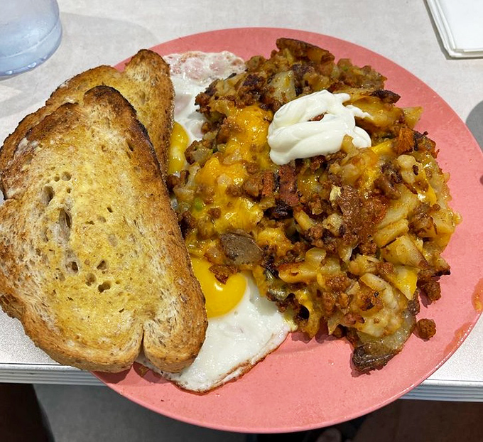 Chorizo hash topped with melted cheese and sour cream&mdash;proof that breakfast potatoes can be the main event, not just a supporting player.