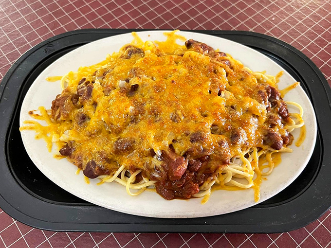 Cincinnati meets Italy in this hearty plate of spaghetti and chili, topped with a snowdrift of cheese that melts into pure Midwestern bliss.