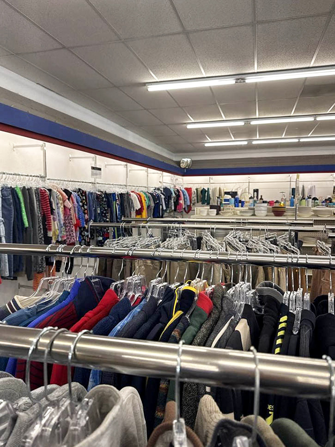 The children's section bursts with primary colors and tiny hangers, where outgrown clothes await their next adventure with a new family.