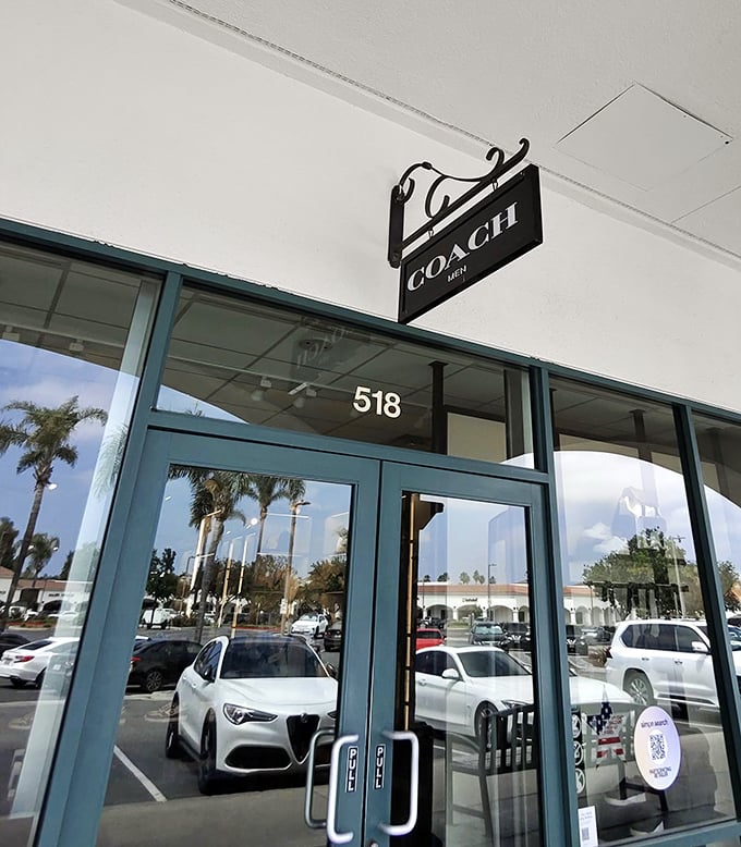 The Coach Men store reflects California cool in its windows. Even luxury brands understand the allure of a good deal.
