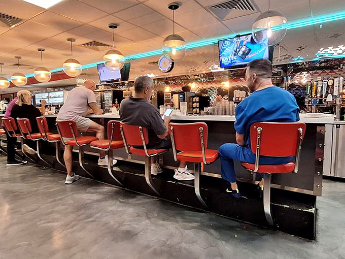 Step right up! These classic red diner stools practically whisper, &ldquo;Sit down, friend&mdash;stories and coffee await.