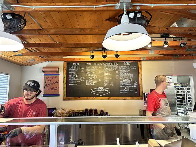 The counter where dreams come true. Those staff members aren't just servers&mdash;they're gatekeepers to a realm of smoky deliciousness.