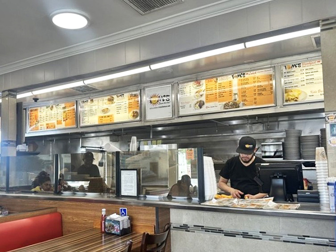 The counter where regulars perch and staff efficiently transform orders into edible art. A front-row seat to the delicious drama of diner life.