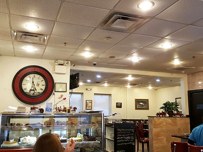 The Eiffel Tower clock watches over diners like a Parisian timekeeper ensuring nobody rushes through breakfast.