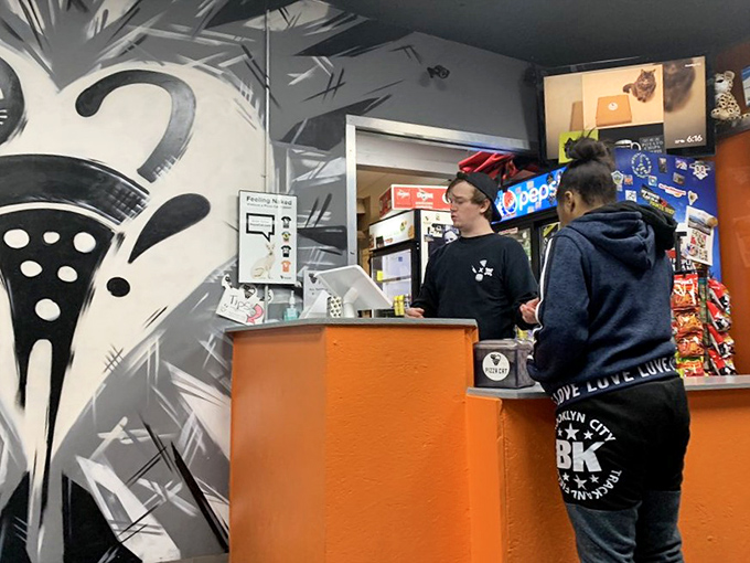 The ordering counter&mdash;where pizza dreams come true and diet plans go to die. Worth every delicious calorie that follows.