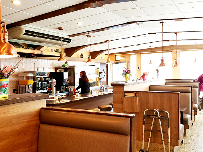 The counter seating offers front-row tickets to the kitchen ballet, where breakfast magic happens before your very eyes.