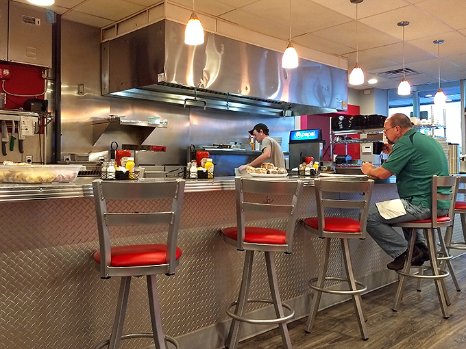 Counter seating: where solo diners become part of the breakfast ballet, watching short-order choreography while sipping bottomless coffee.