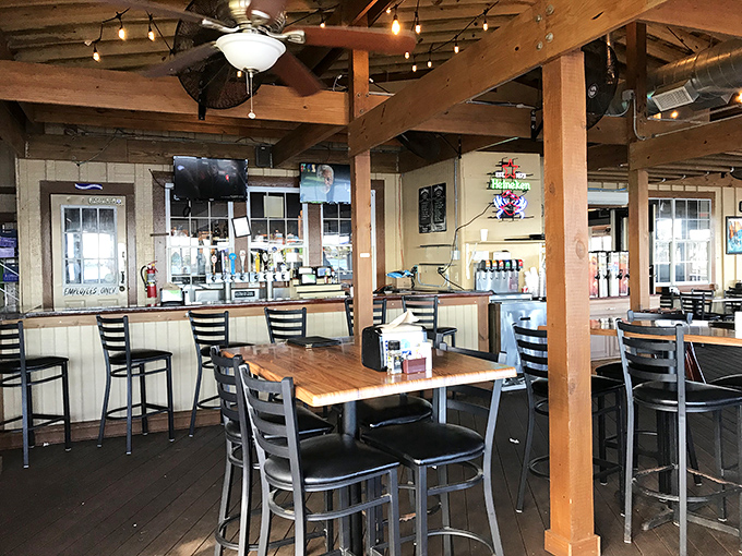 Where nautical meets practical: The bar area invites you to pull up a chair, order something refreshing, and watch the boats drift by.